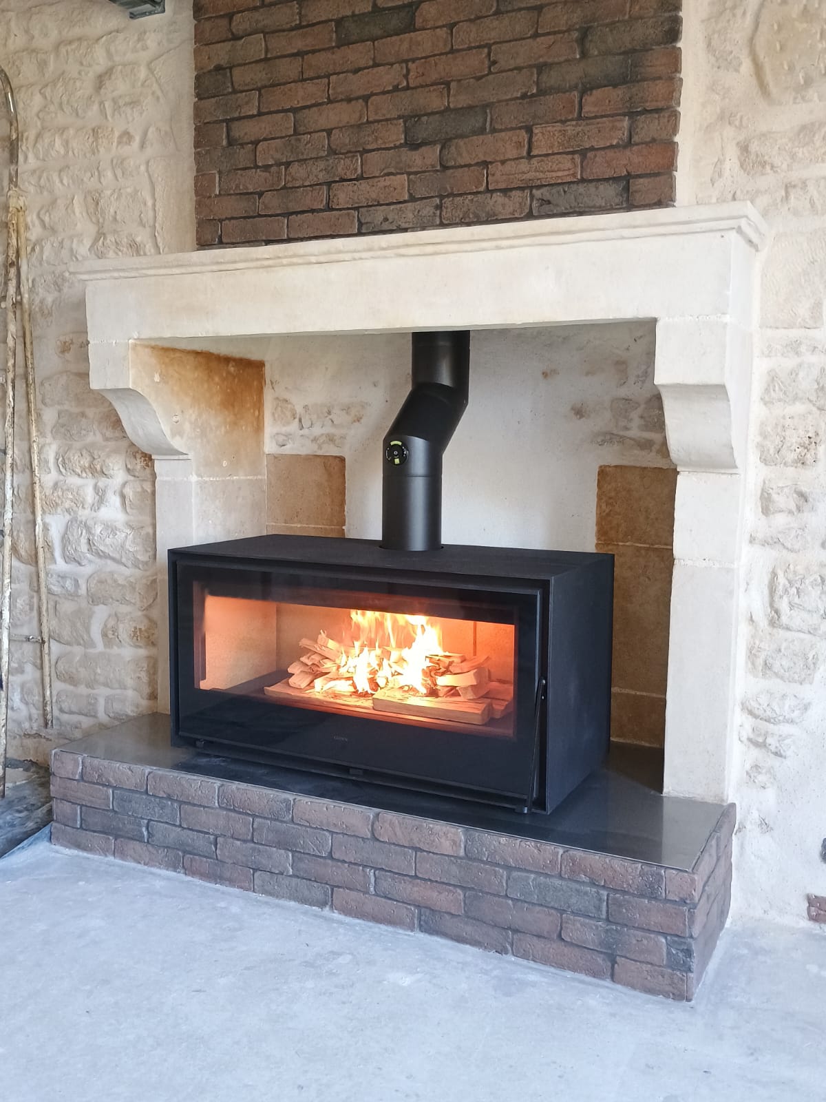 Pose d'un poêle à bois dans une cheminé à Xanton Chassenon - Kbane